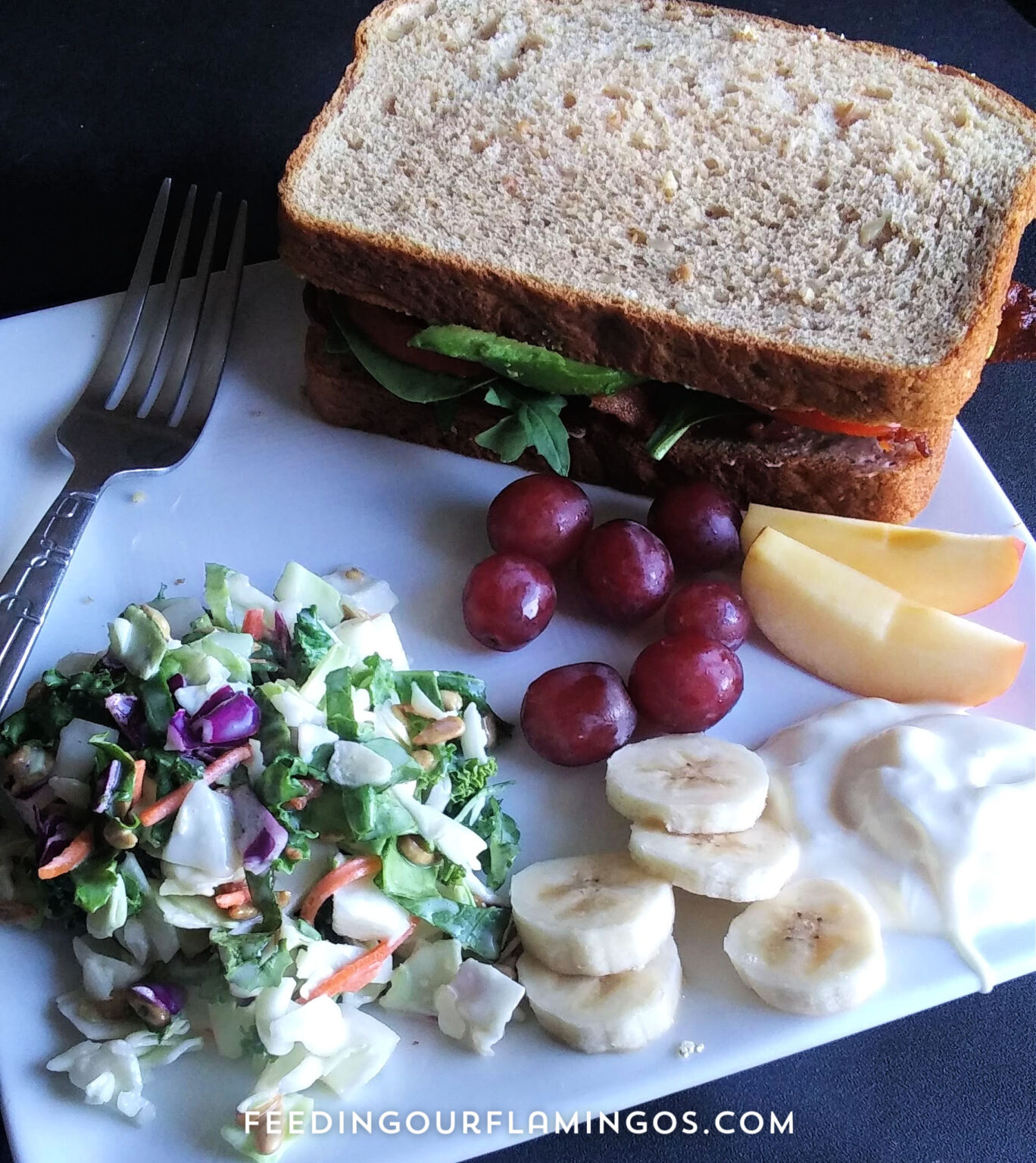 BLTA Sandwiches with fresh fruit and salad